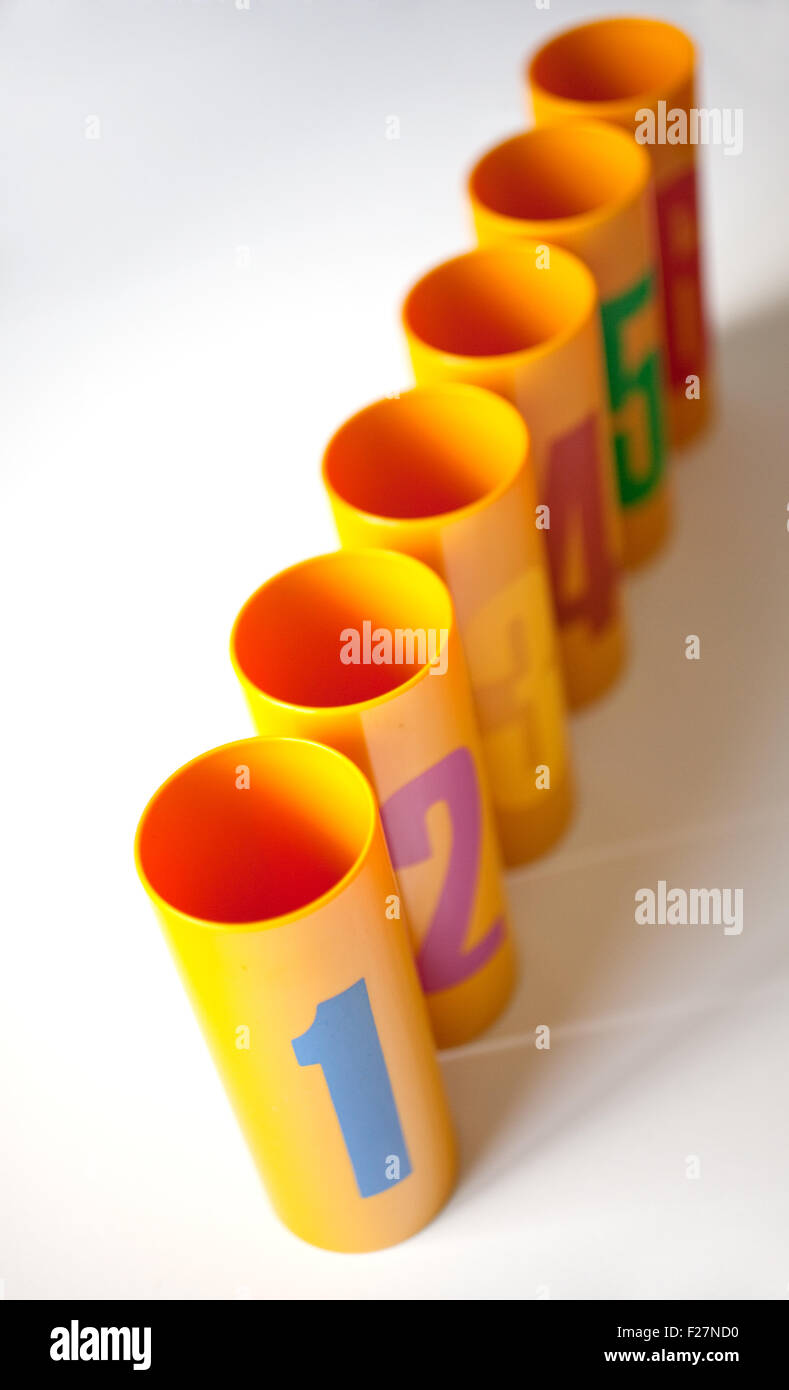 Yellow plastic cans numbered one to six - colored numbers Stock Photo ...