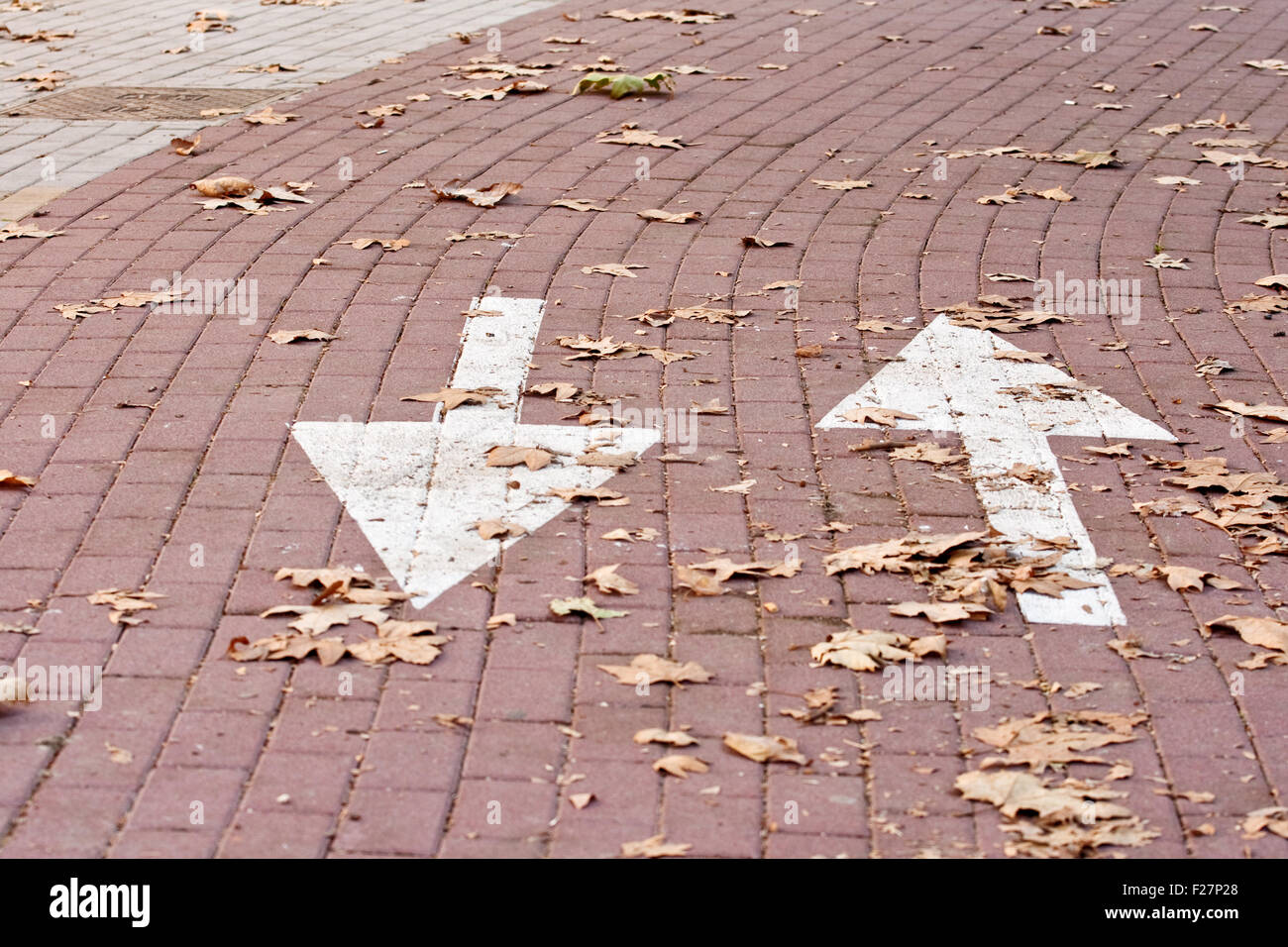 Arrow sign on the road Stock Photo - Alamy