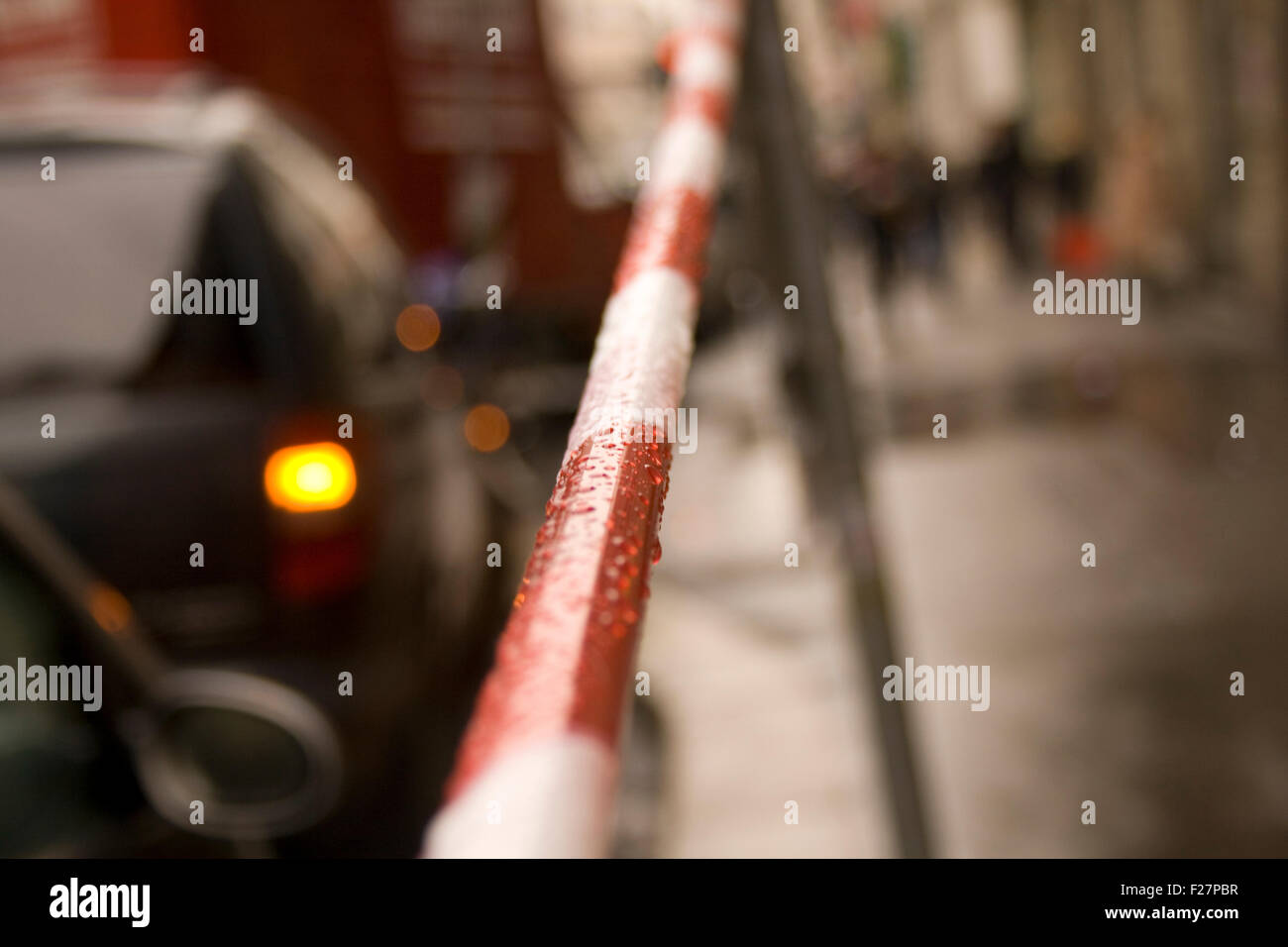 Red and white Band signaling next to a car Stock Photo - Alamy