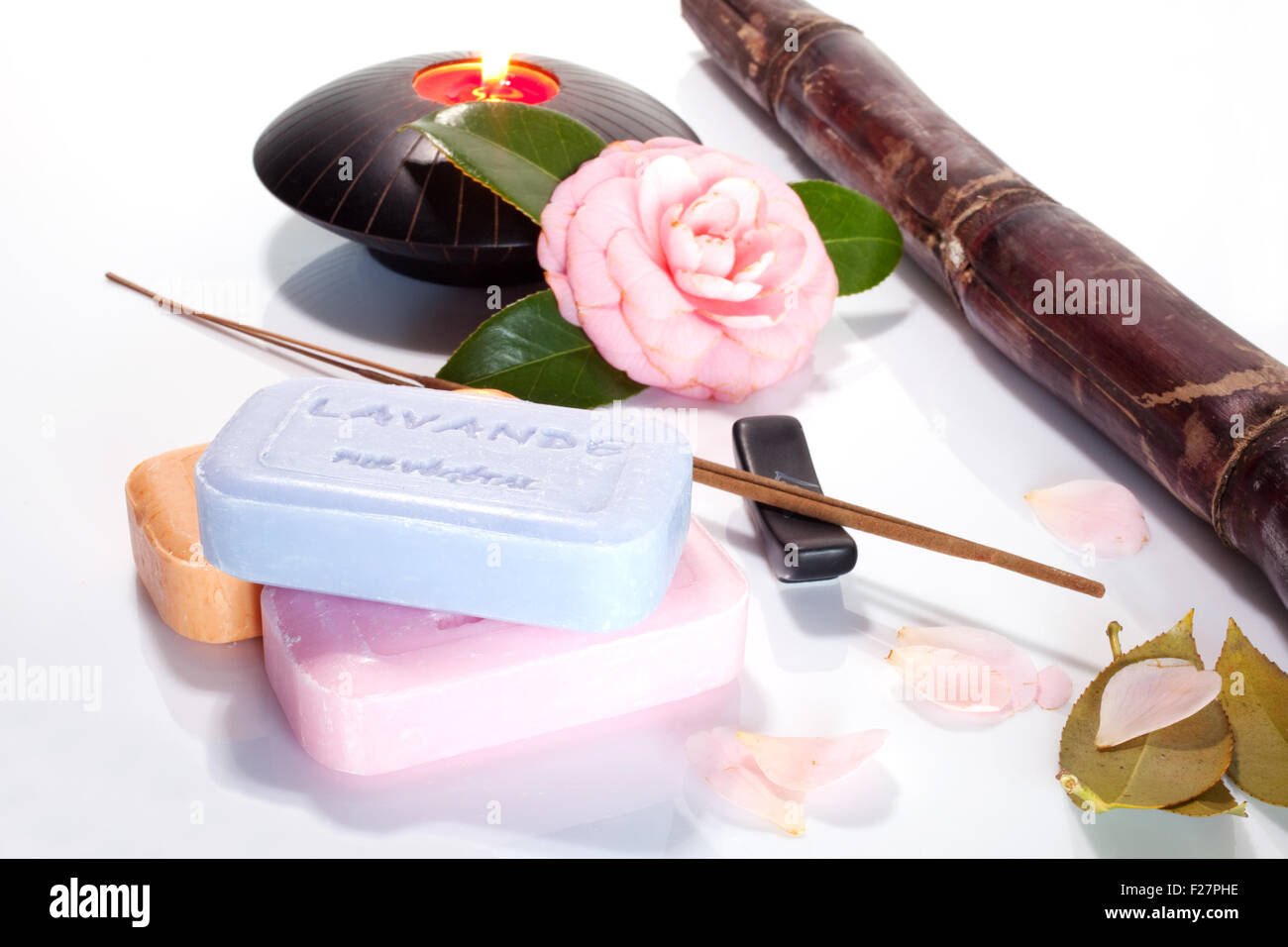 Incense, flower and soap on white Stock Photo - Alamy