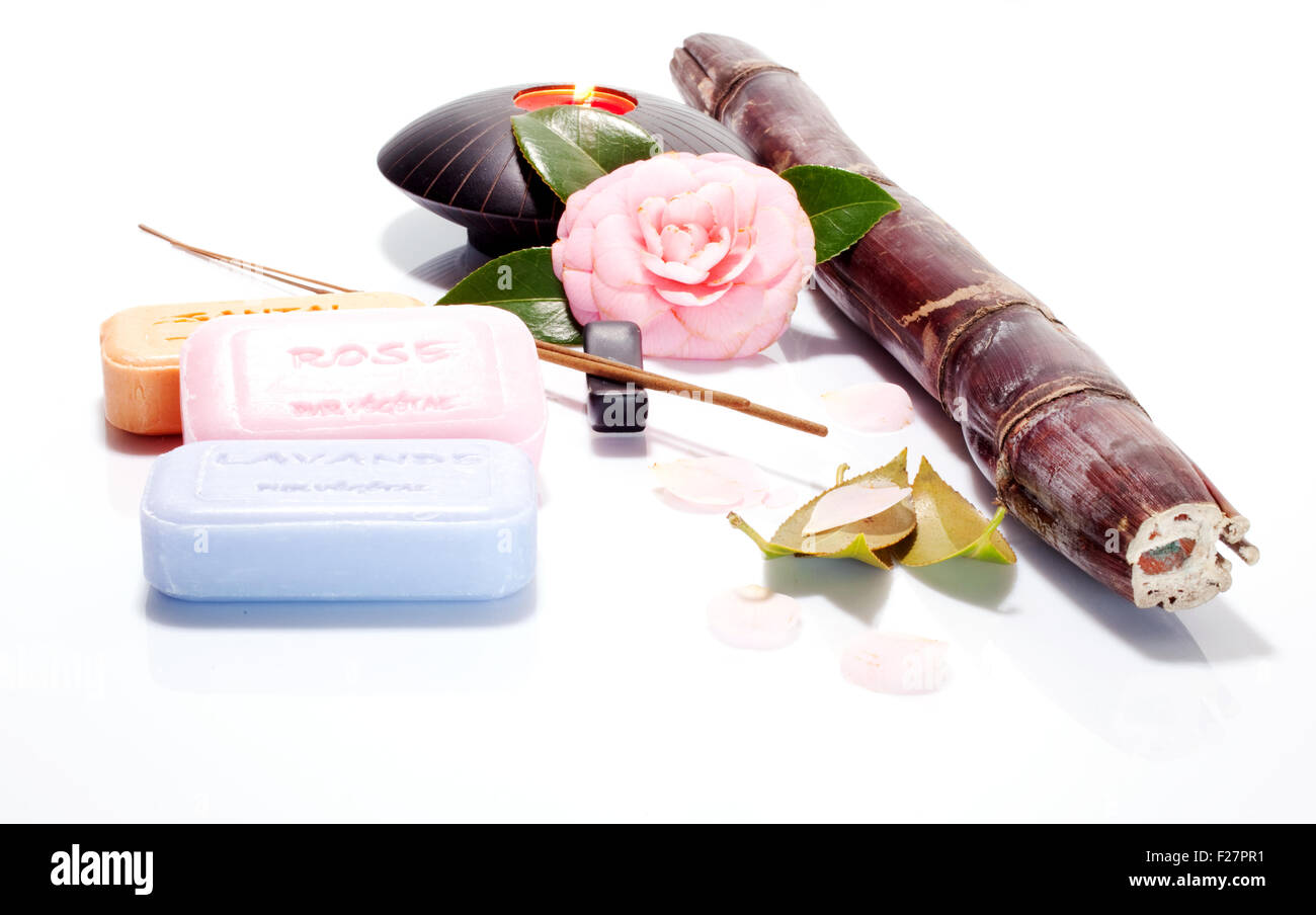 Incense, flower and soap on white Stock Photo - Alamy