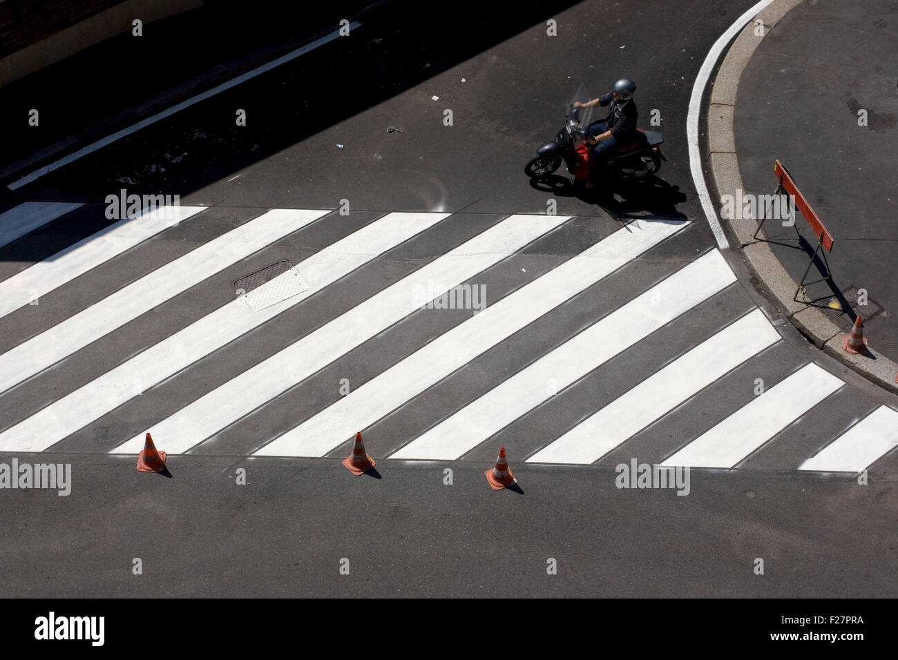 Motorcyclist on thr road with fresh pedestrian crossing Stock Photo - Alamy