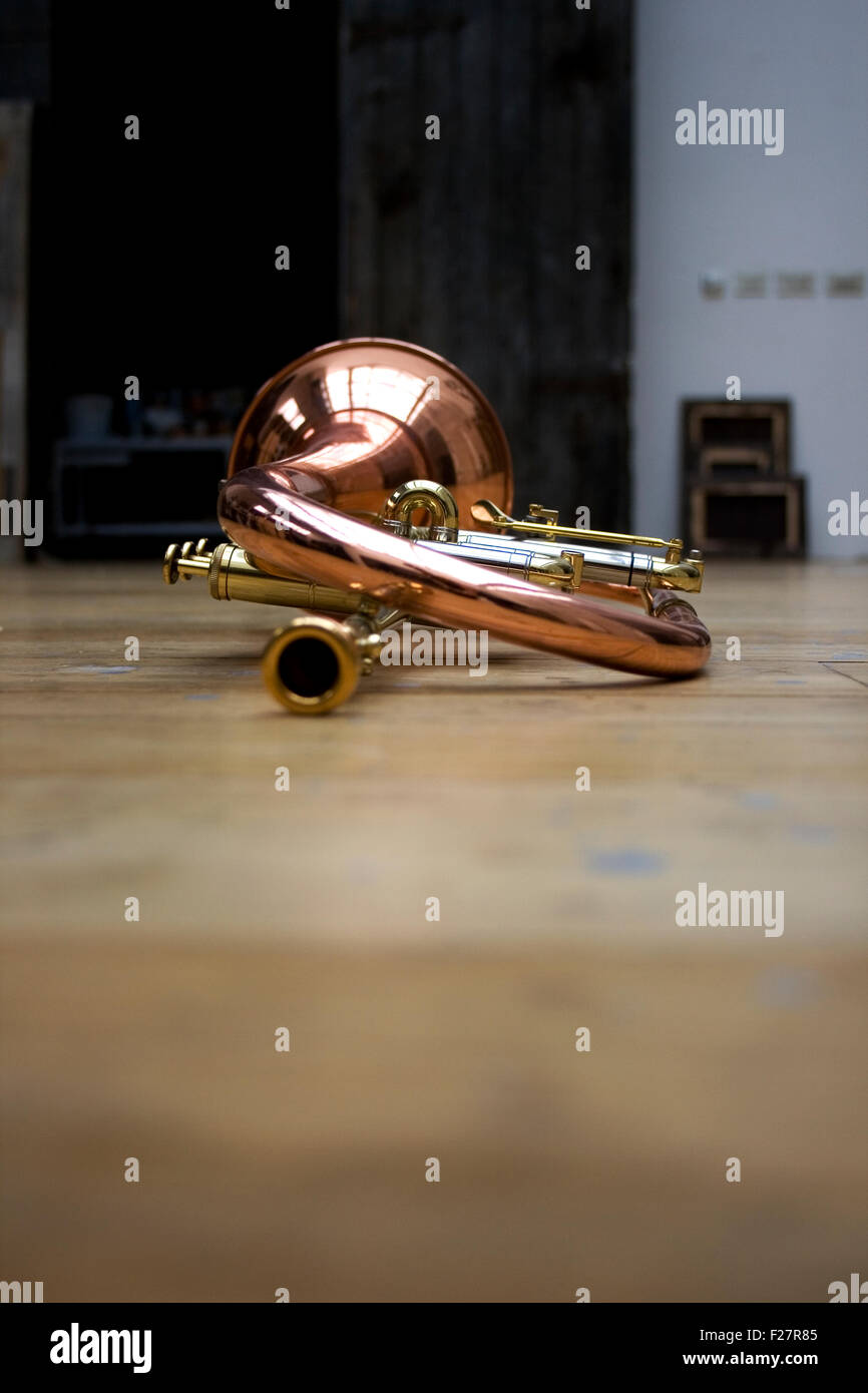 Trumpet on a wooden floor Stock Photo - Alamy