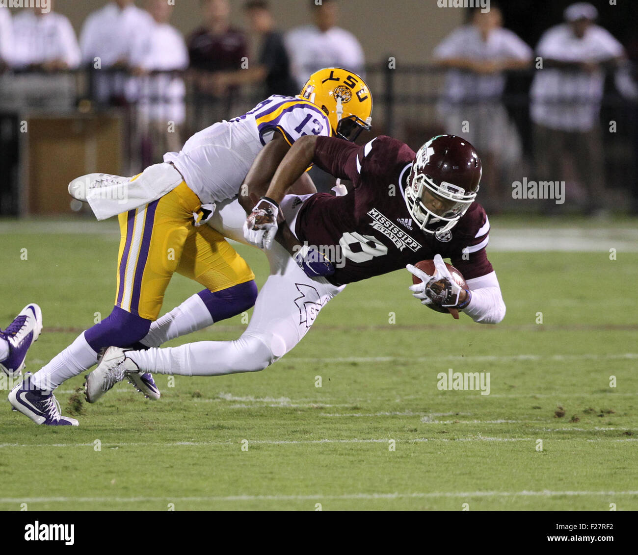 LSU CB, Dwayne Thomas (13) stops Mississippi State WR, Fred Ross (8 ...