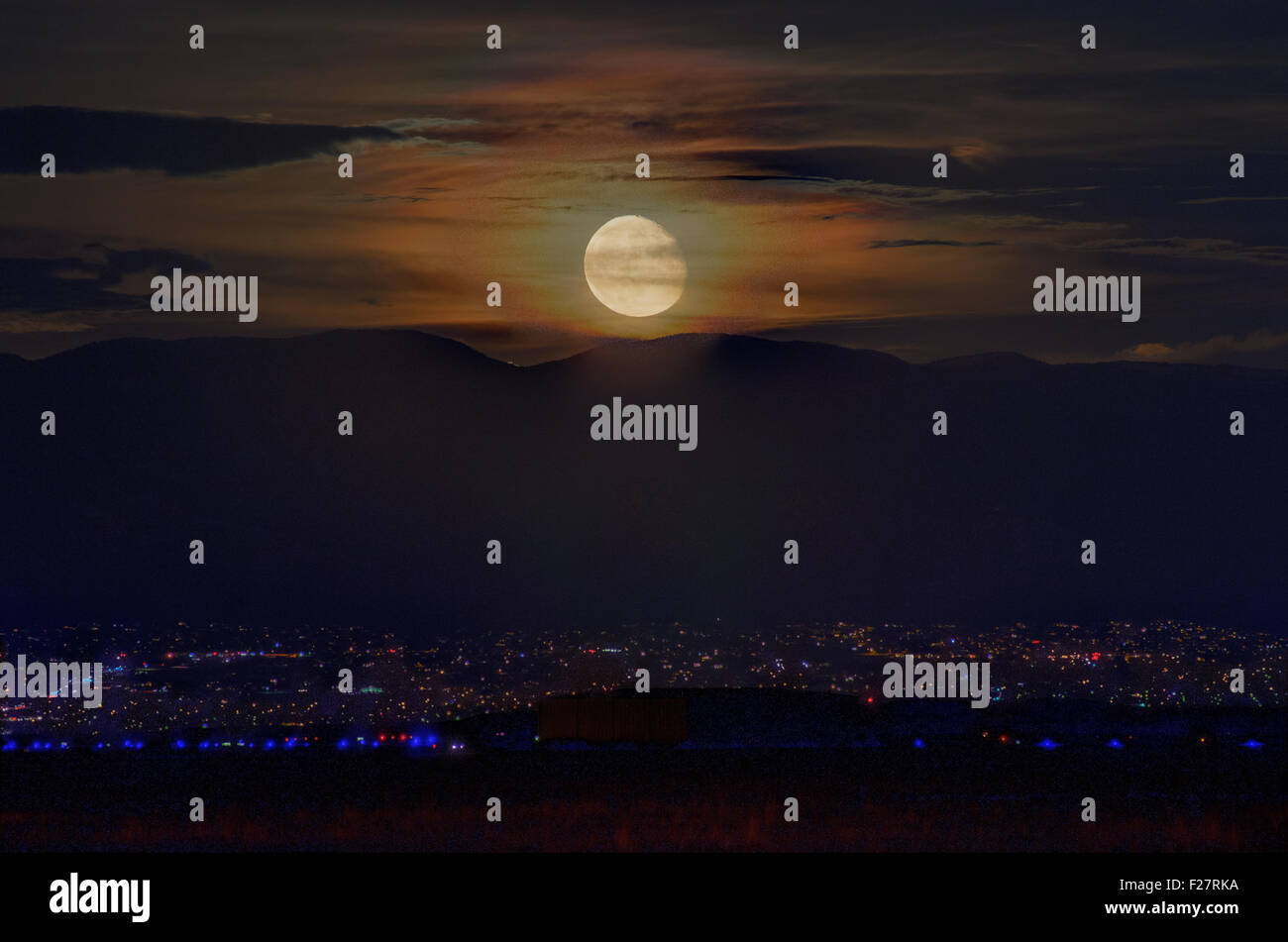 Nearly full moon rise over Albuquerque and the Sandia mountains, New ...