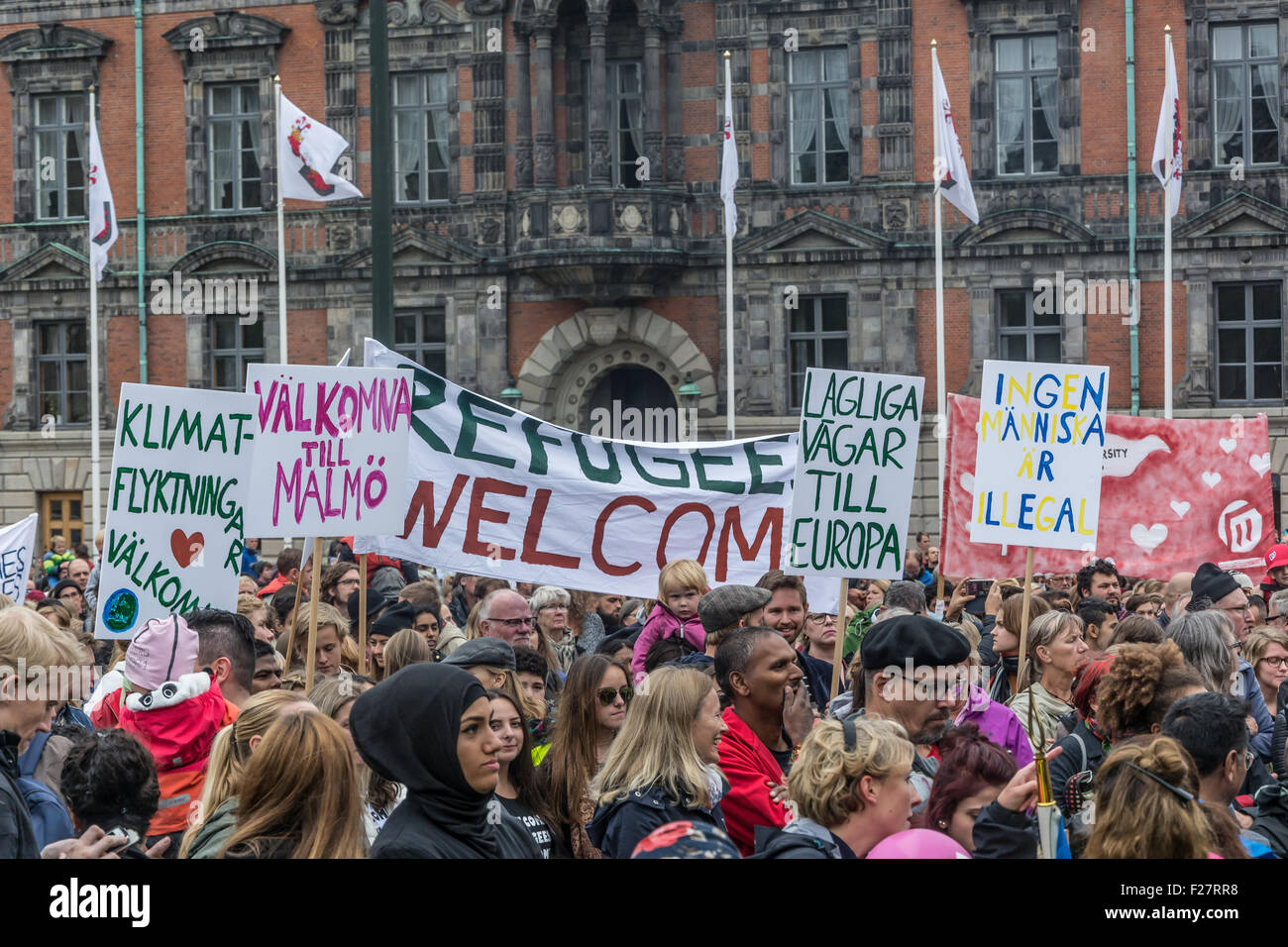 Malmo, Sweden. 13th Sep, 2015. Huge crowd hold banners showing their ...
