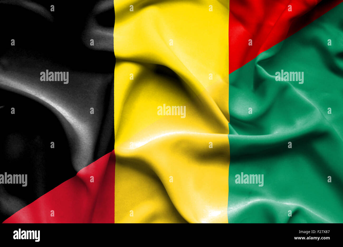 Waving flag of Guinea and Belgium Stock Photo - Alamy
