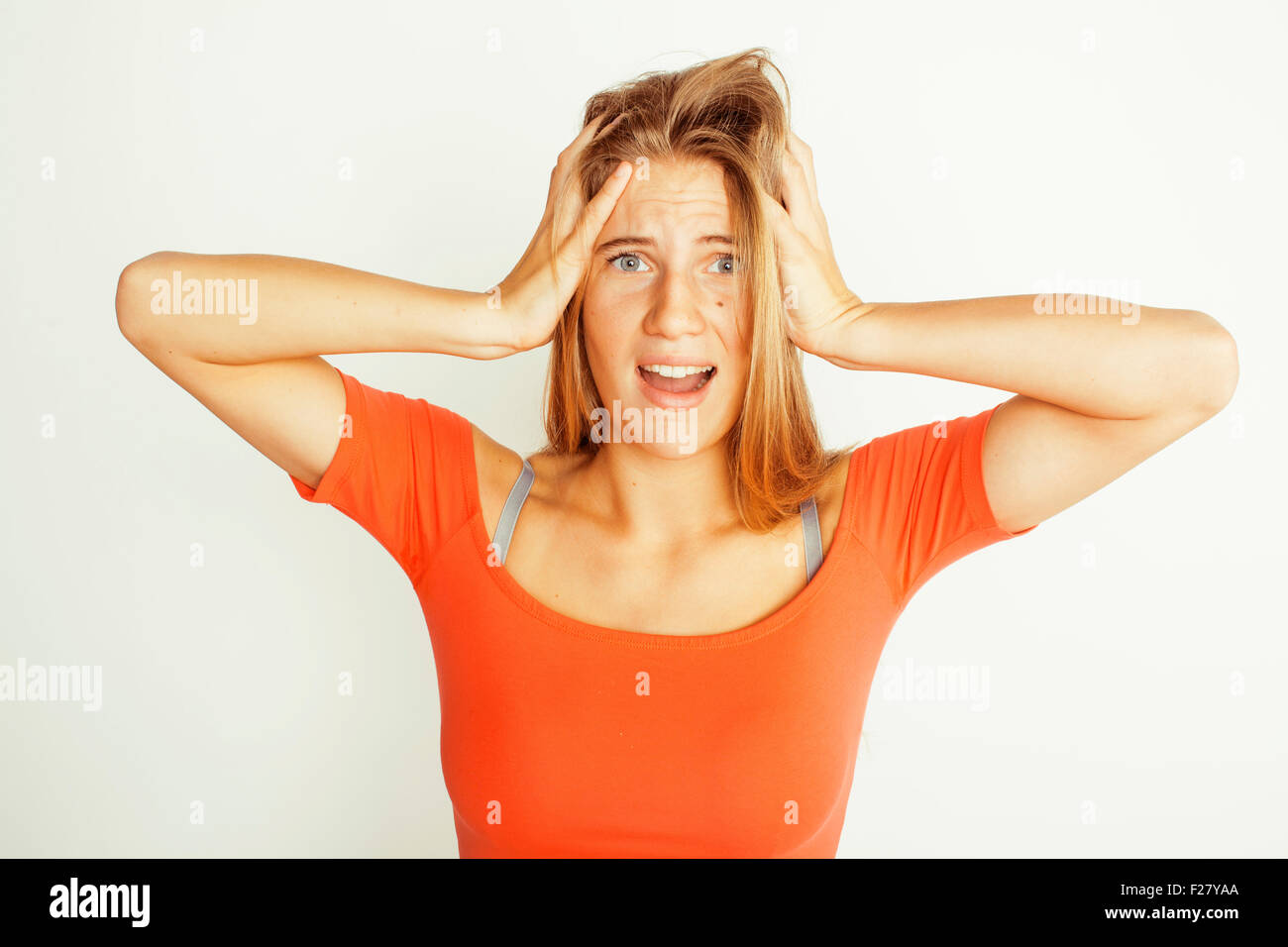young pretty woman hands on head, screaming isolated white Stock Photo ...