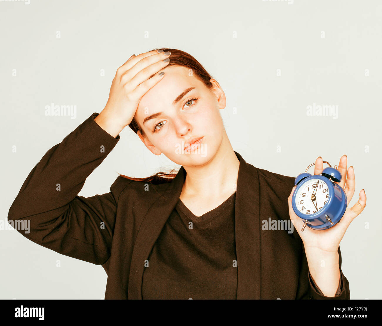 young beauty woman in business style costume waking up for work early ...