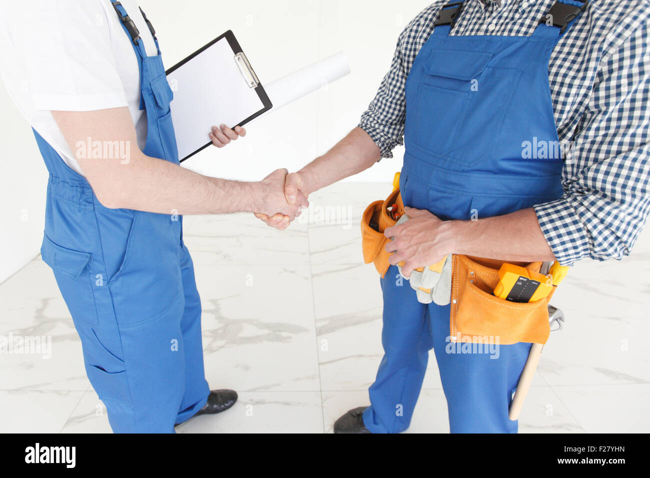 close-up of hadshake of two workmen Stock Photo - Alamy