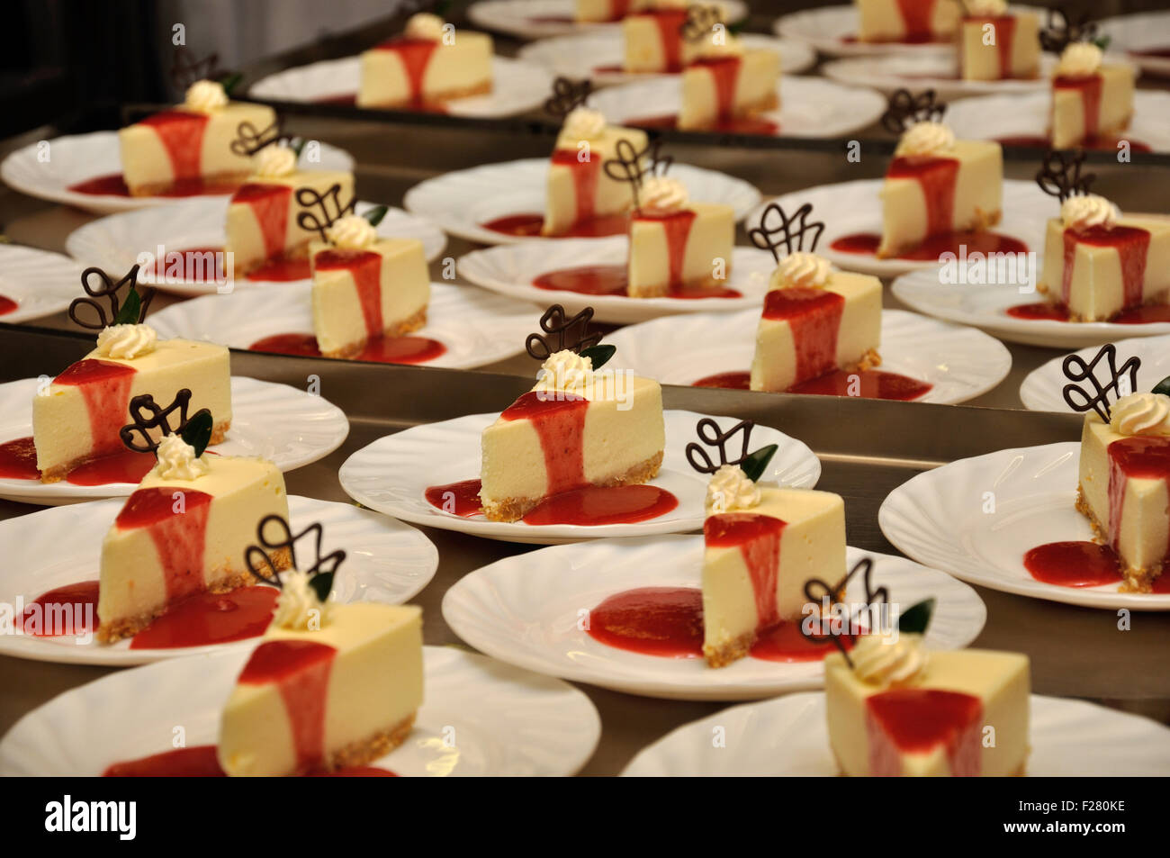Plates of cheesecake ready to serve at a reception Stock Photo - Alamy