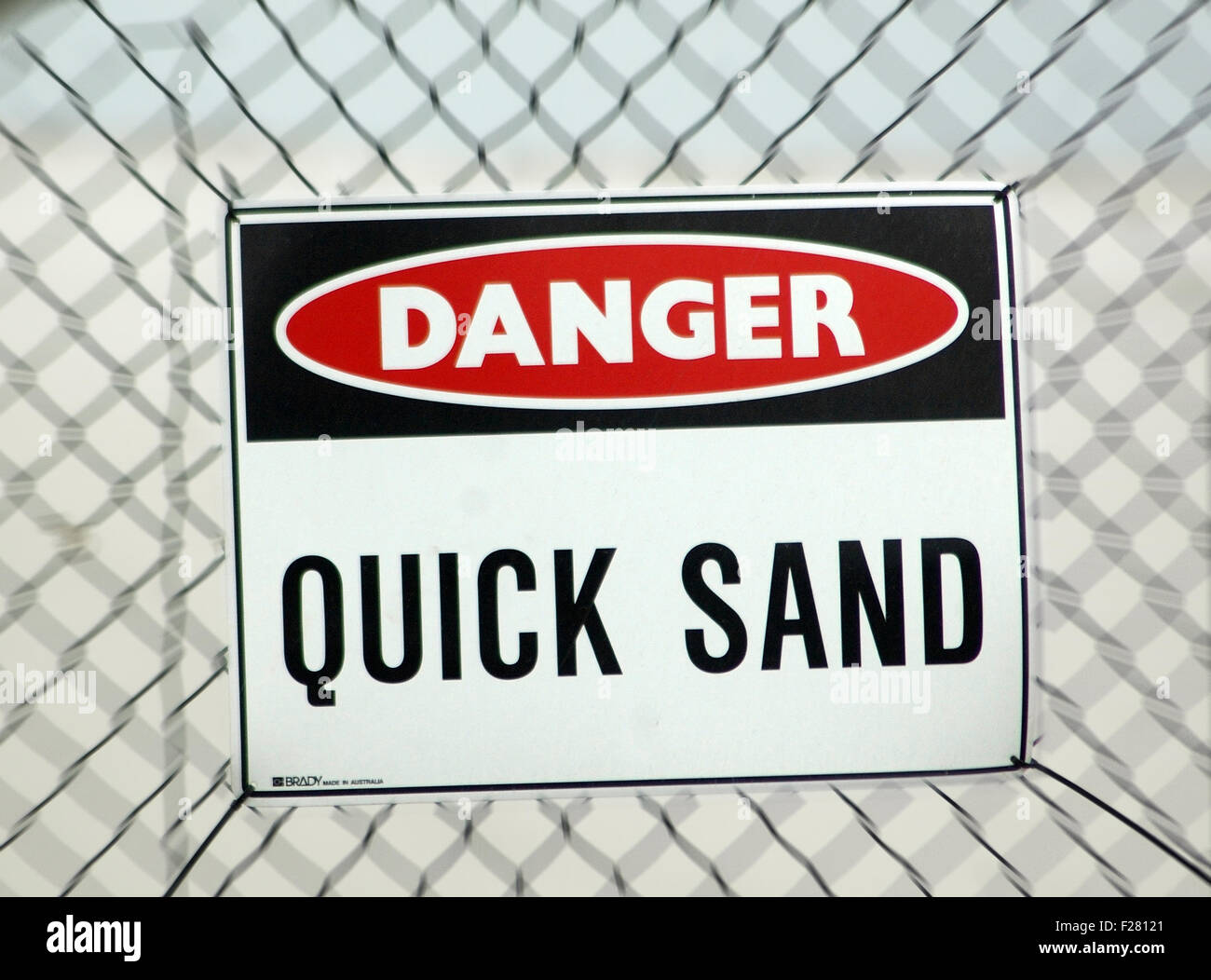 signage warning against quick sand in development area Stock Photo - Alamy
