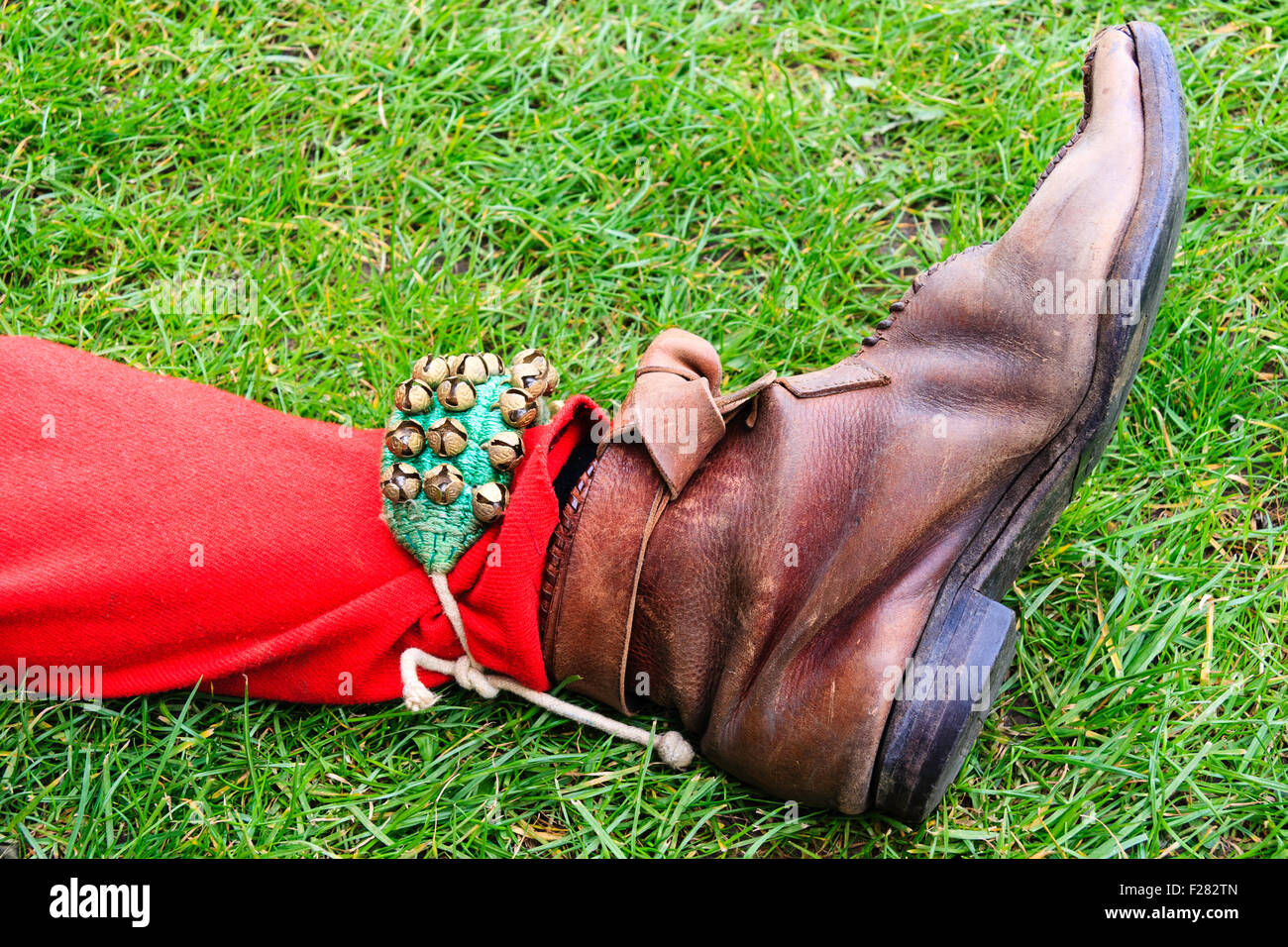Medieval living history display. Close up of leg of minstrel, in ...