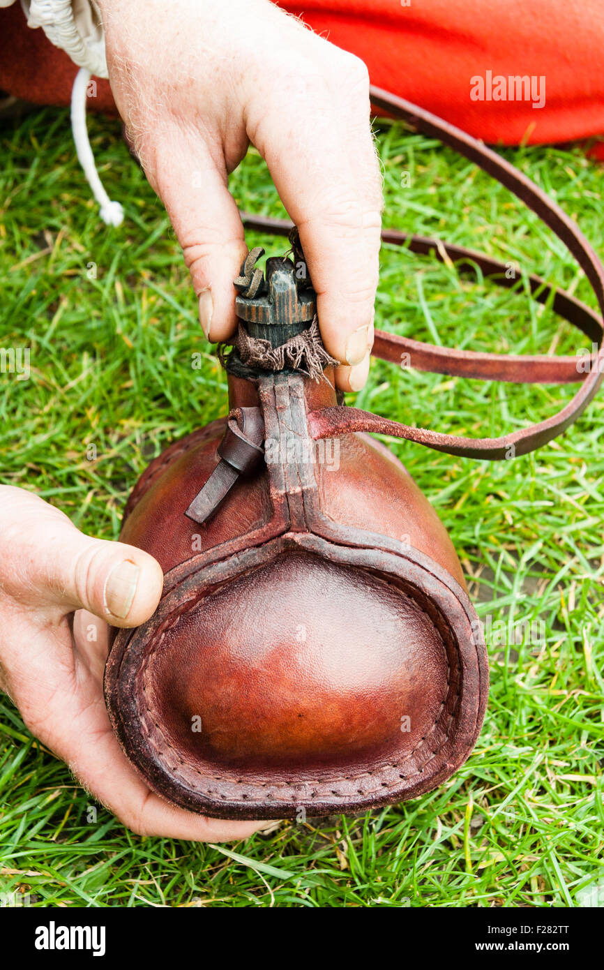 England. Handmade medieval costrel, a leather water or mead bottle ...
