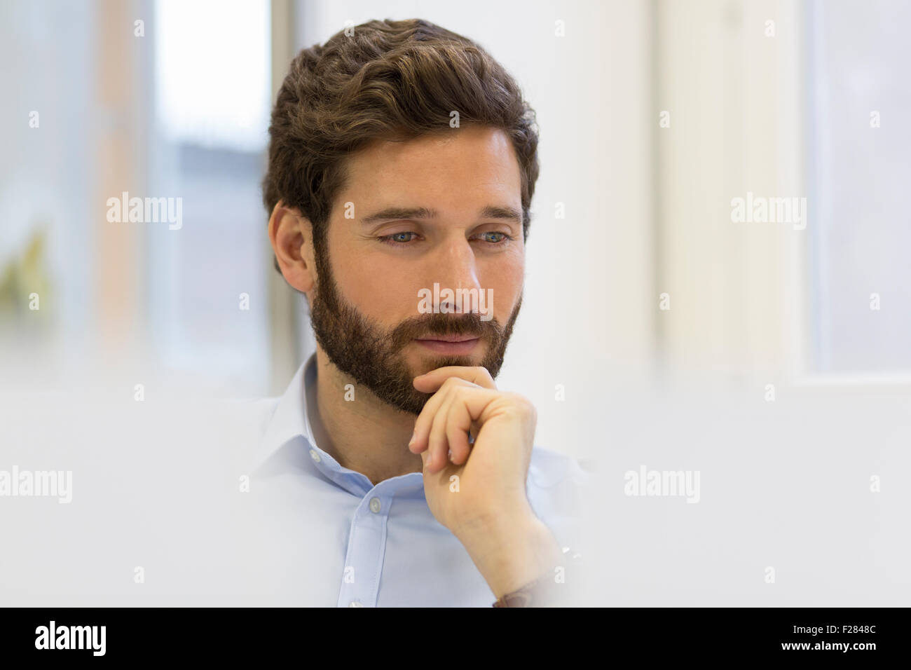 Pensive businessman in modern office Stock Photo - Alamy Pensive businessman in modern office Stock Photo - Alamy