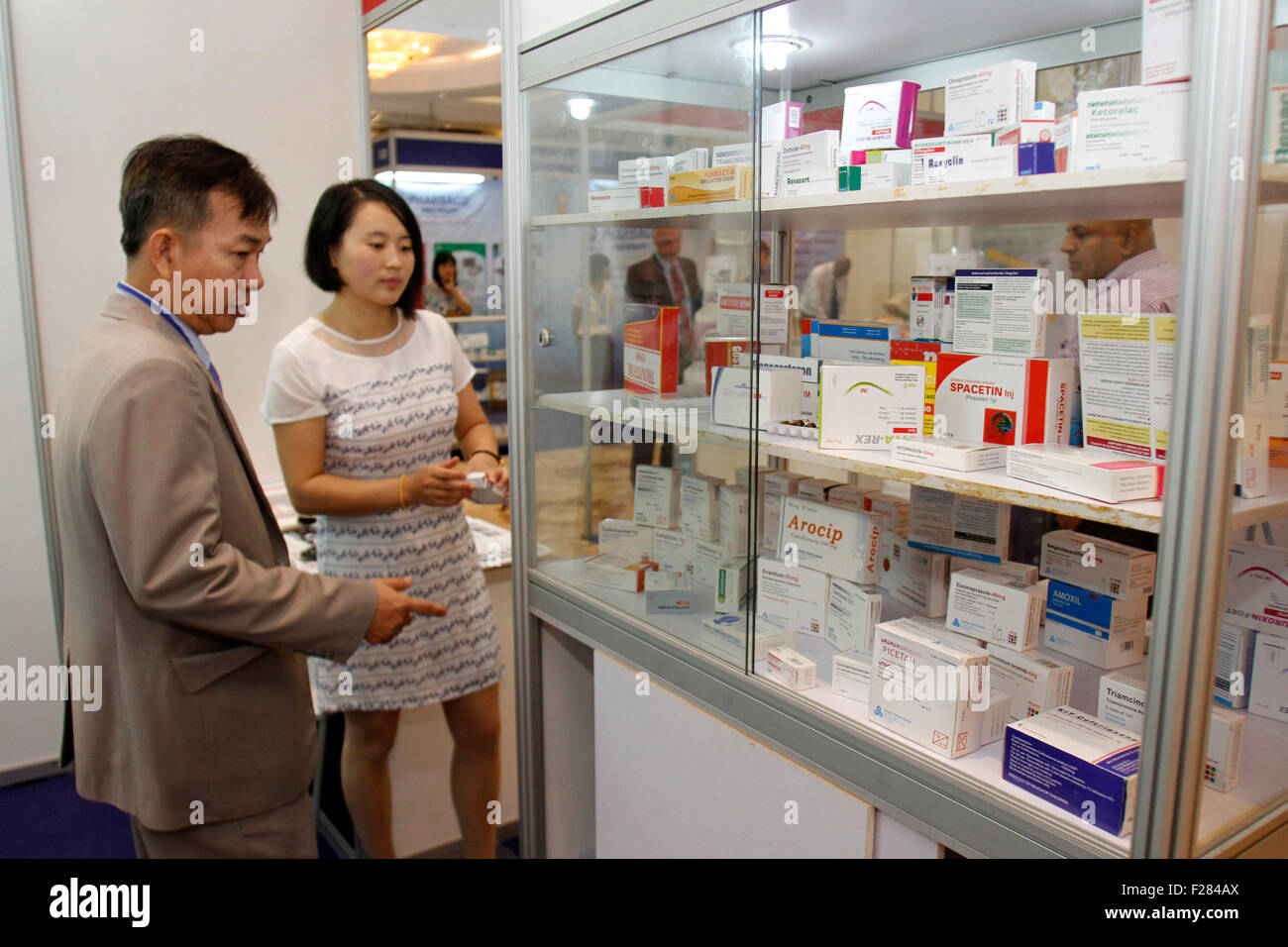 Phnom Penh, Cambodia. 14th Sep, 2015. People look at medical products ...