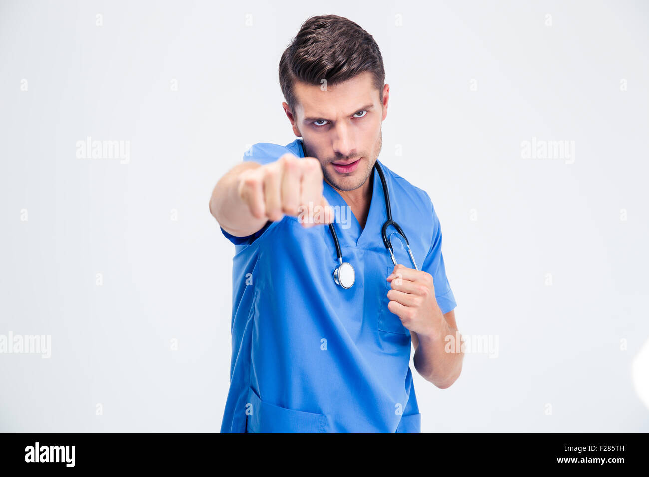 Portrait of a male doctor fighting isolated on a white background Stock ...