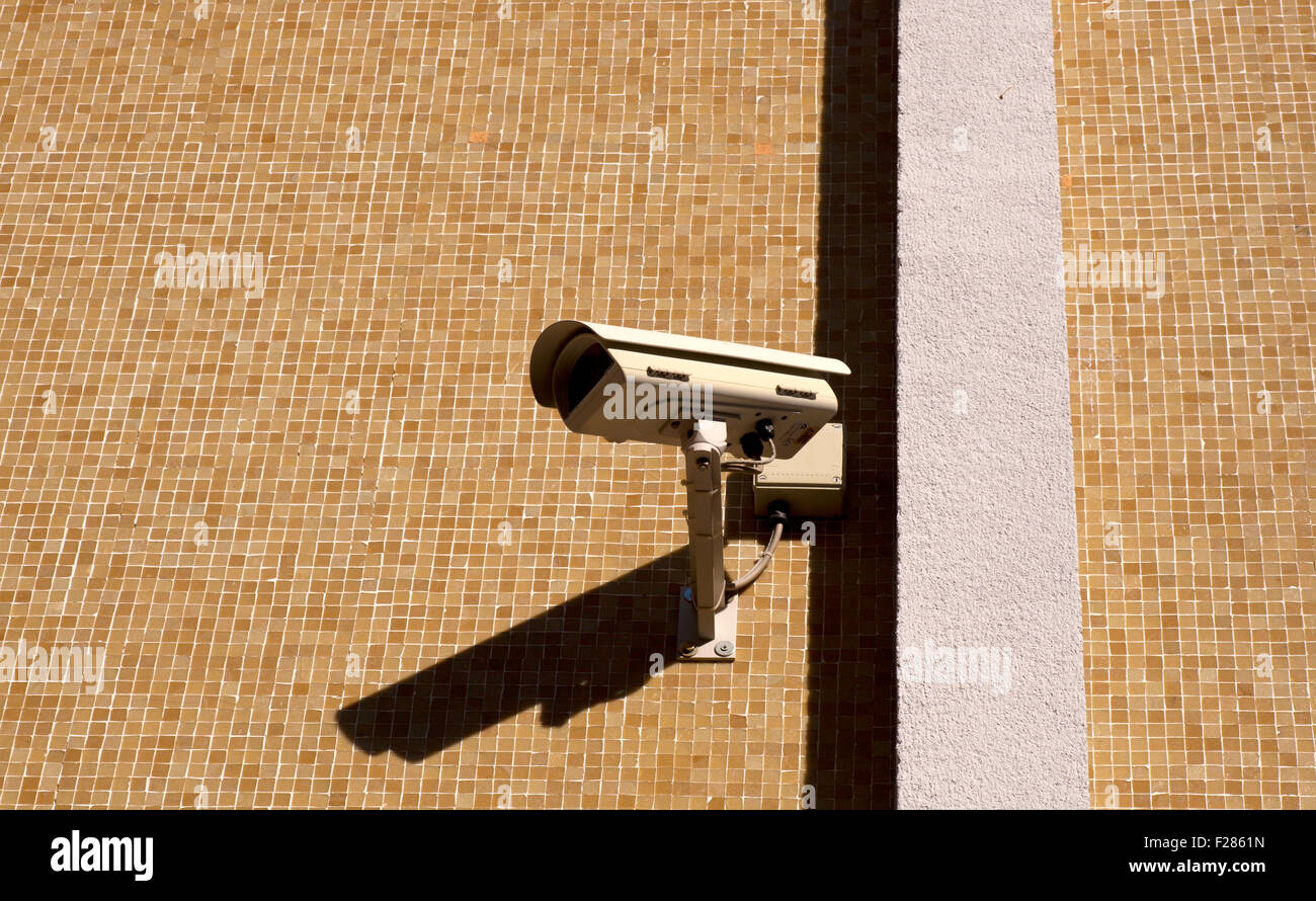 Surveillance camera on the wall Stock Photo - Alamy