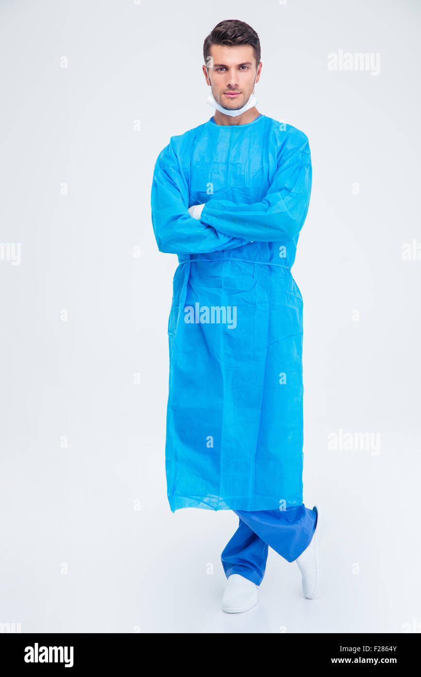 Full length portrait of a handsome male surgeon standing with arms ...