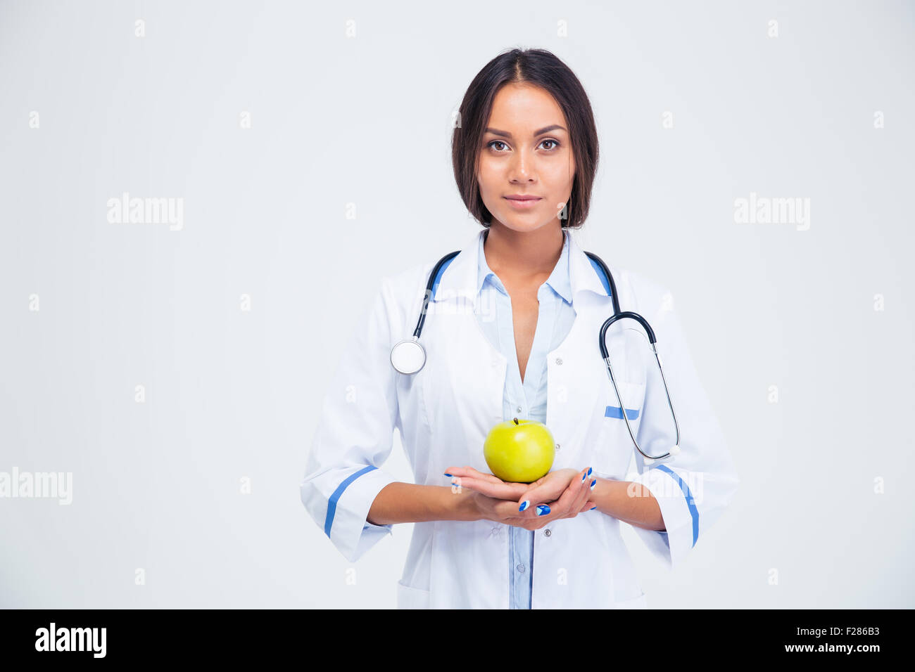 Beautiful and attractive female doctor, isolated over a white ...
