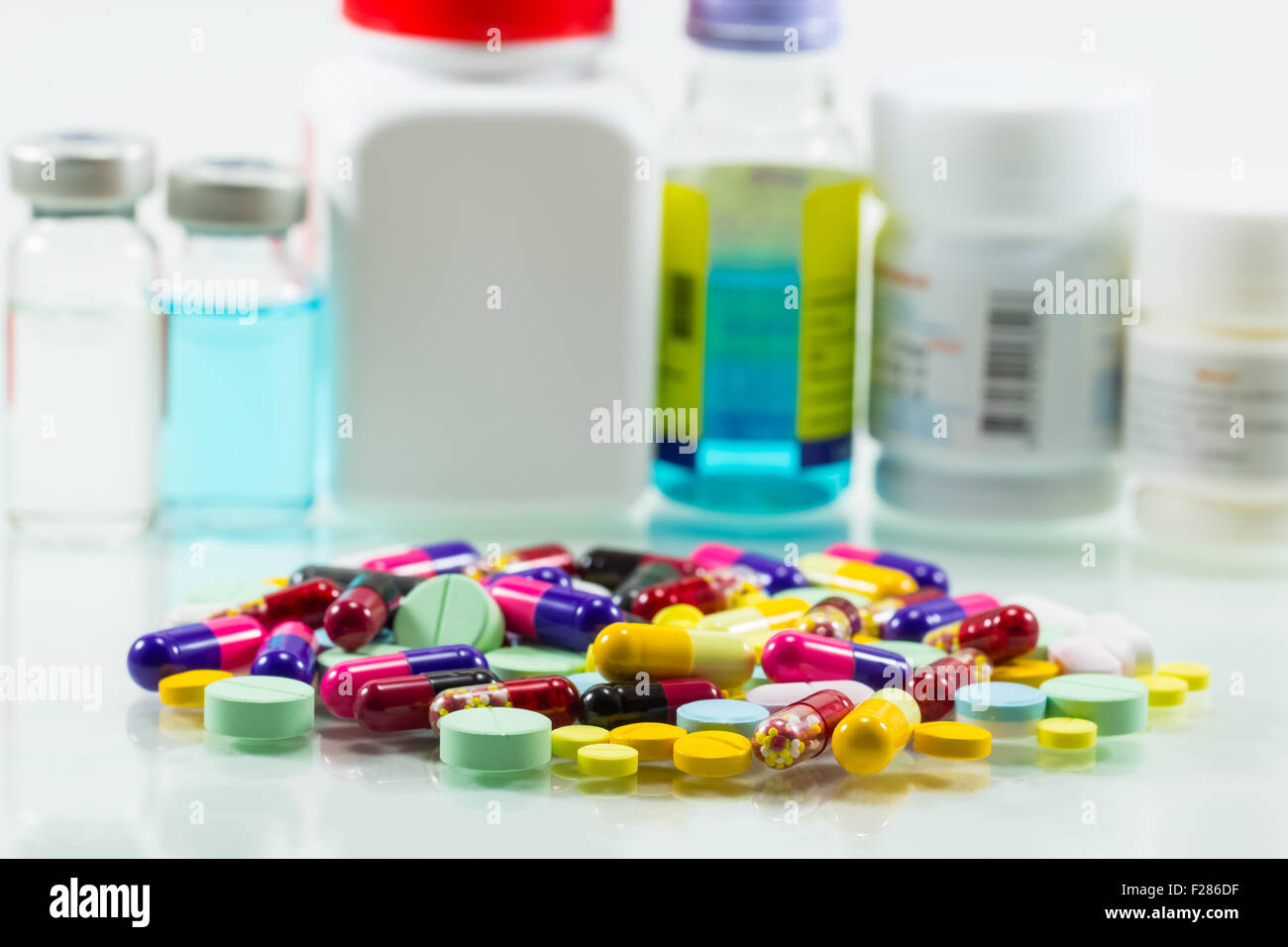 diferent Tablets pills capsule heap mix isolated on white background ...
