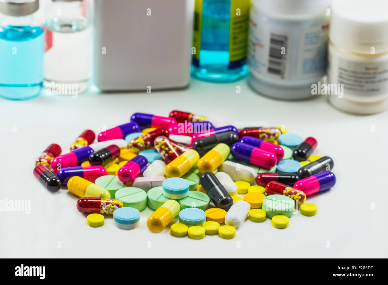 diferent Tablets pills capsule heap mix isolated on white background ...