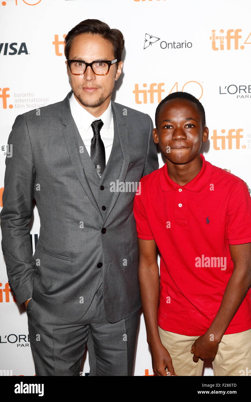 Director Cary Fukunaga (L) and actor Abraham Attah attend the premiere ...