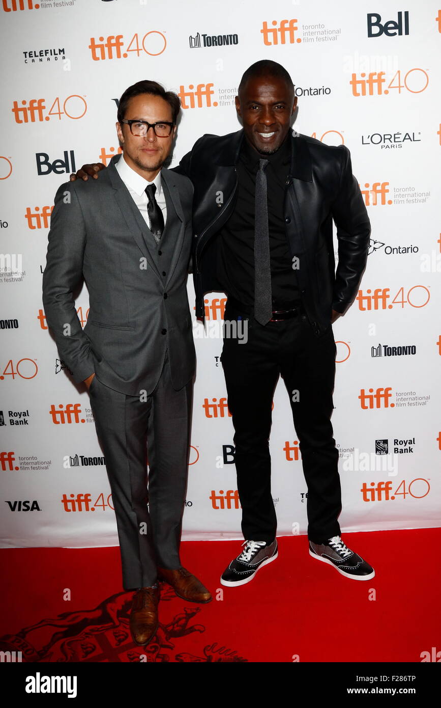 Director Cary Fukunaga and actor Idris Elba (R) attend the premiere of ...