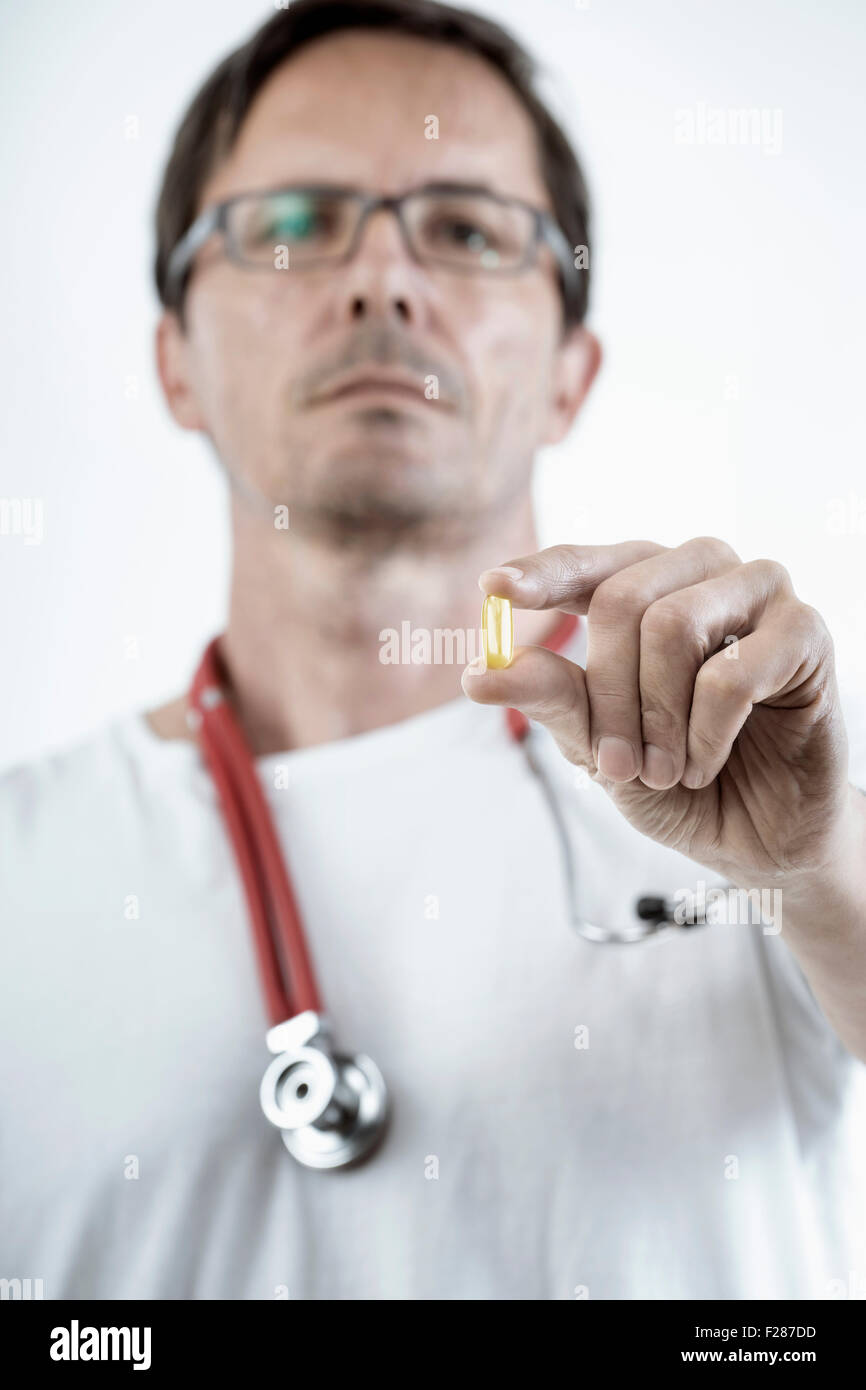 Man holding supplement vertical hi-res stock photography and images - Alamy