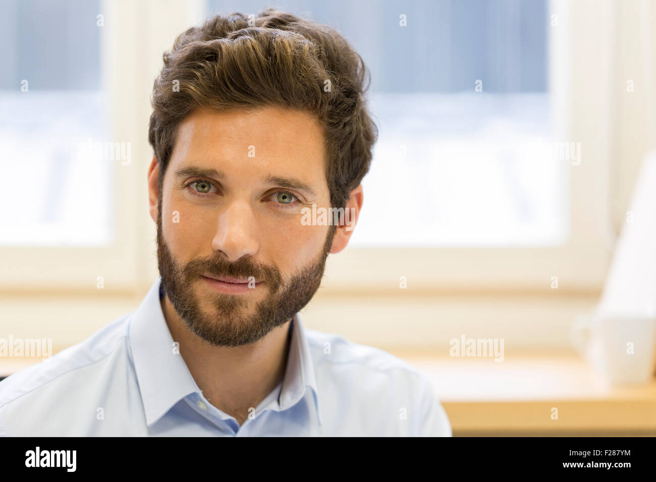 Portrait of bearded businessman in office looking camera Stock Photo ...