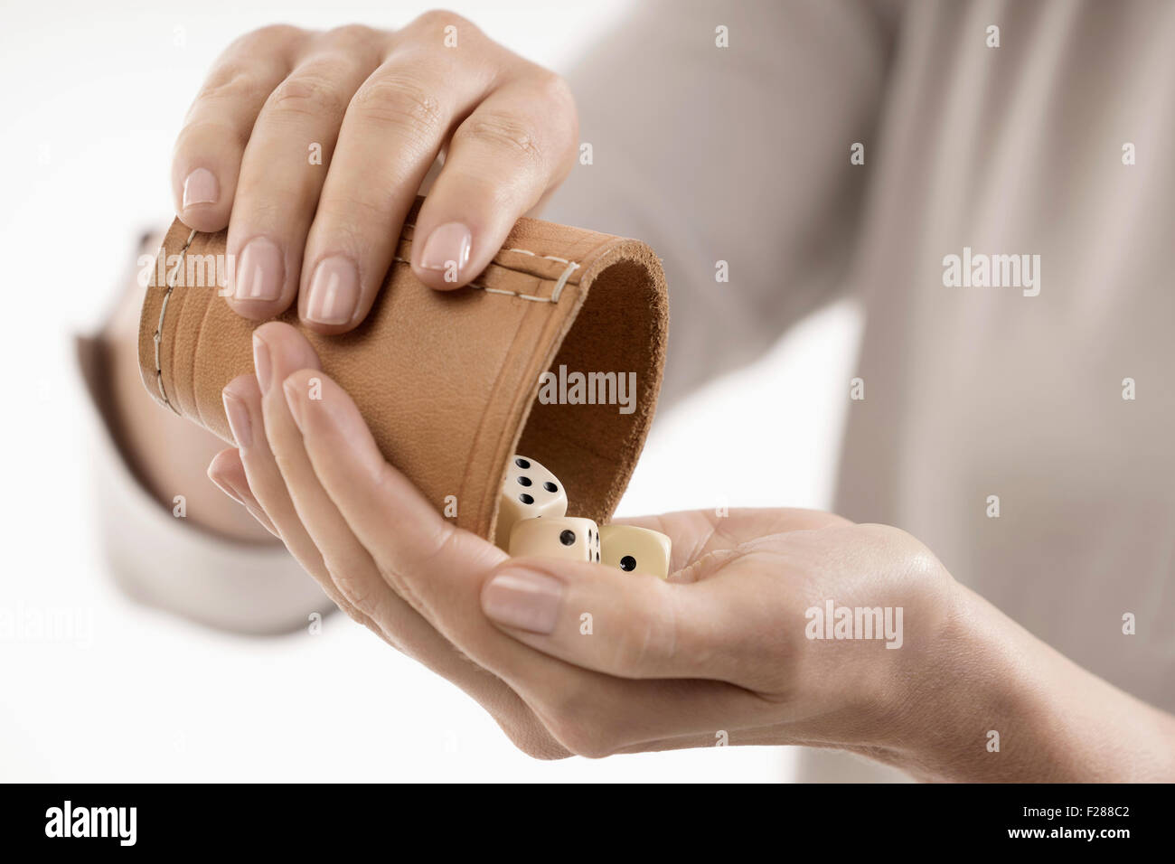 Hand with dice hi-res stock photography and images - Alamy