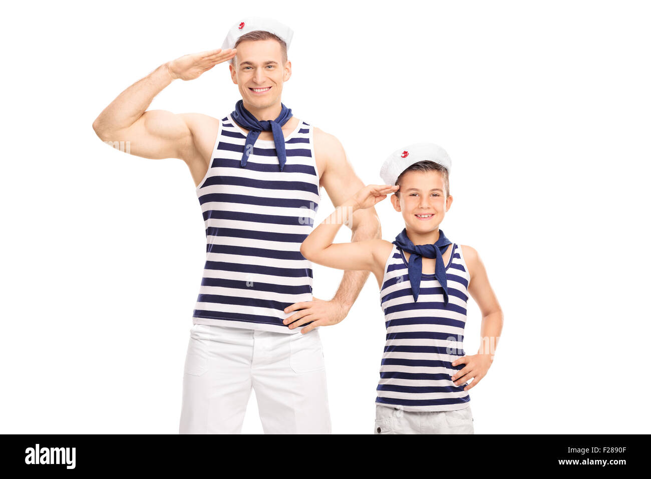 Father and son in sailor uniforms smiling and saluting towards the ...