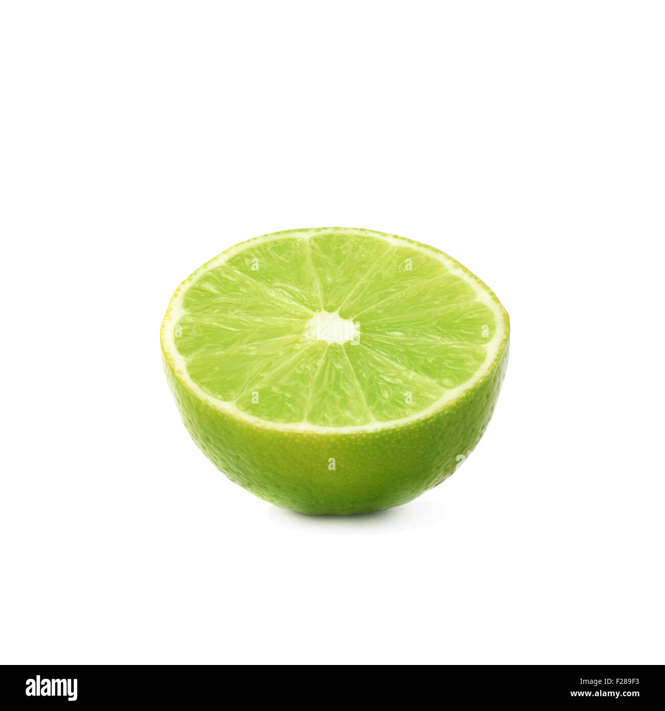 Ripe green lime cut in half isolated over the white background Stock ...