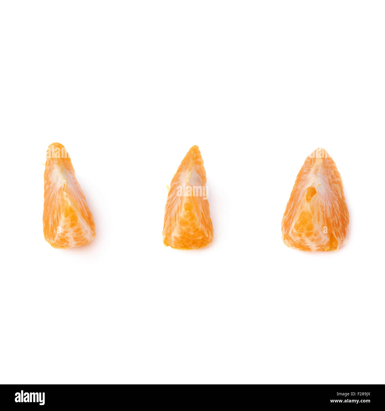 Slice sections of ripe tangerine isolated over the white background ...