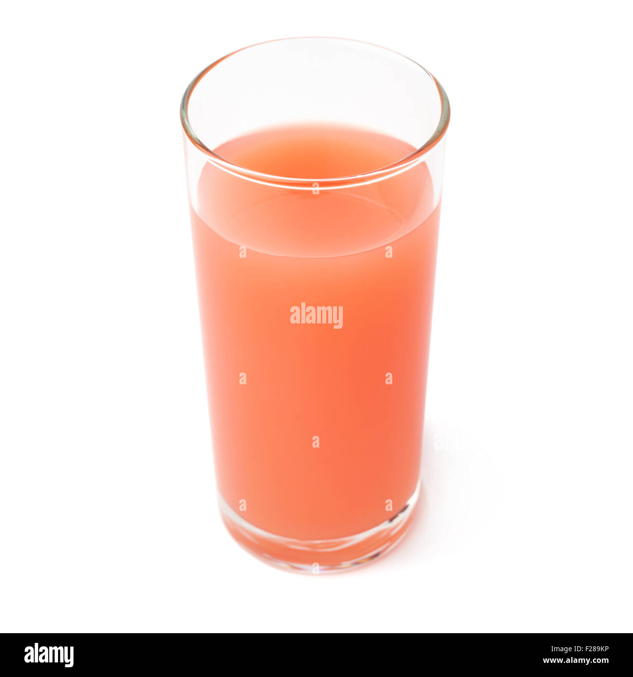 Tall glass filled with the fresh grapefruit juice isolated over the ...