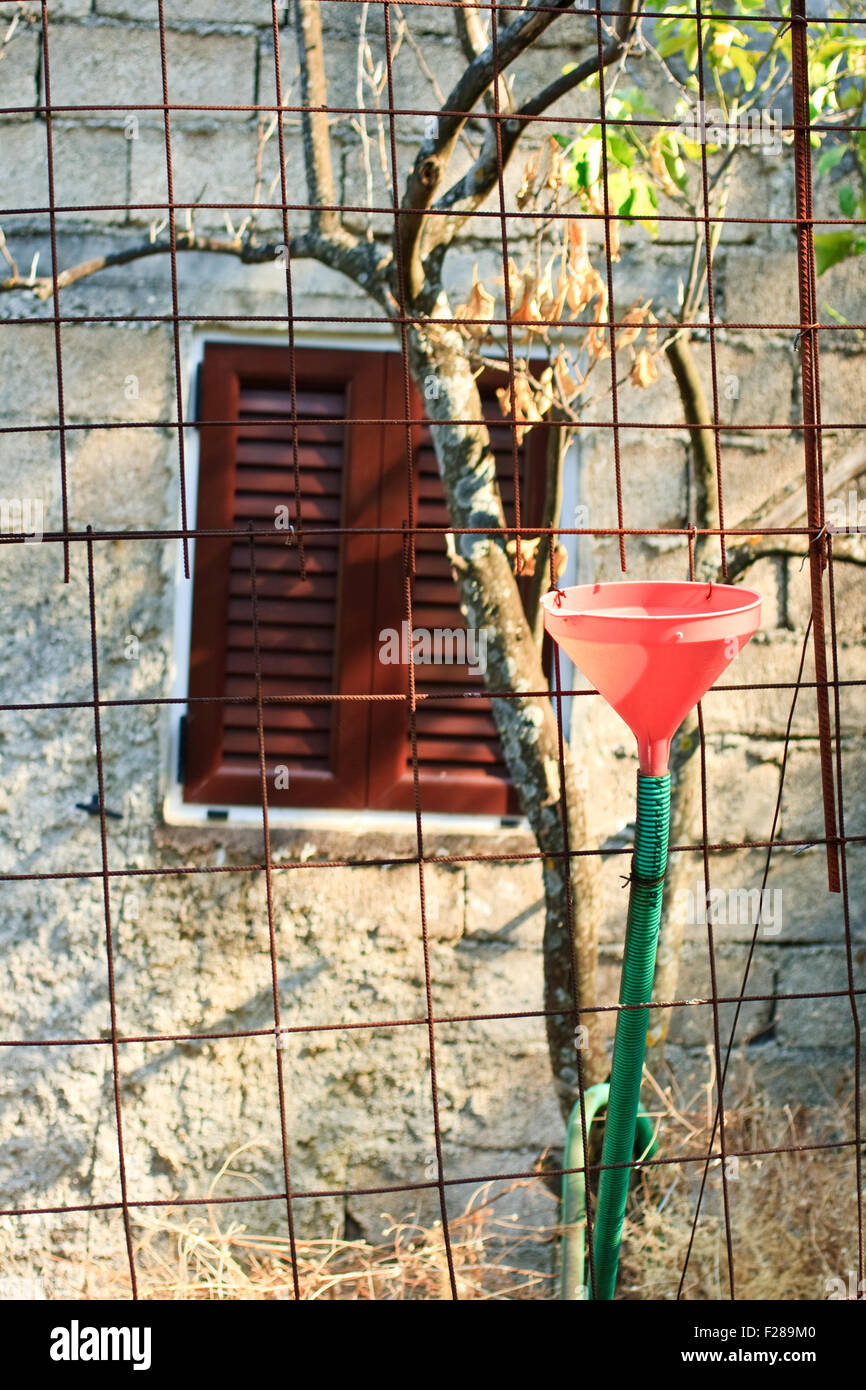 Funnel and cane on wire mesh Stock Photo - Alamy