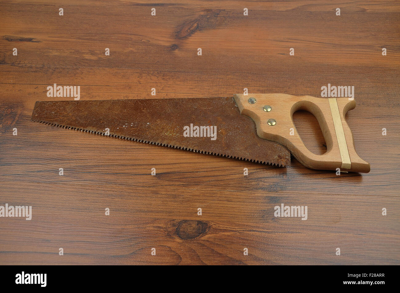 Hand saw on wood Stock Photo - Alamy