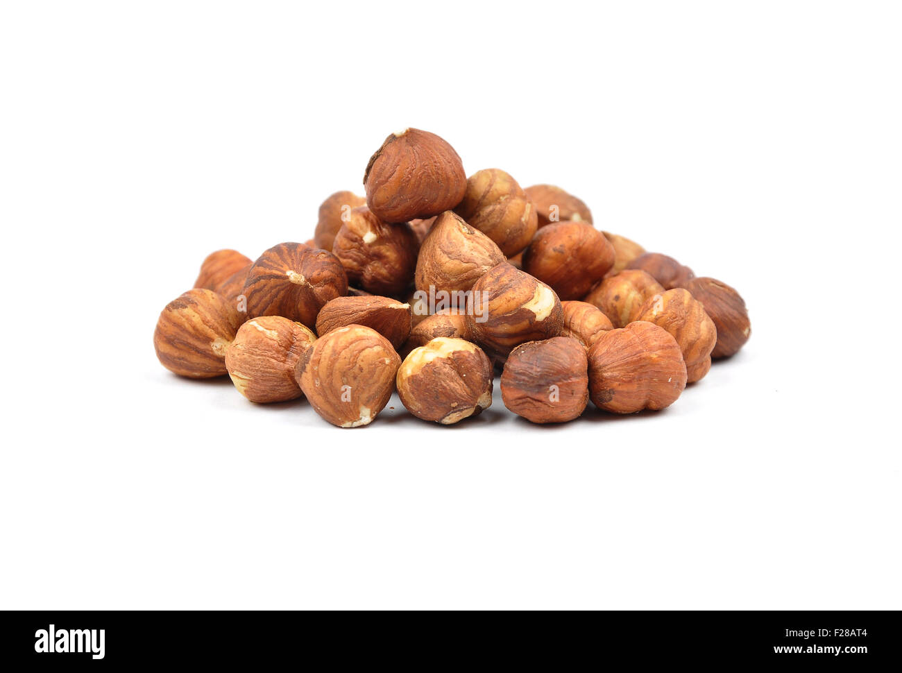 Hazelnuts on white Stock Photo - Alamy