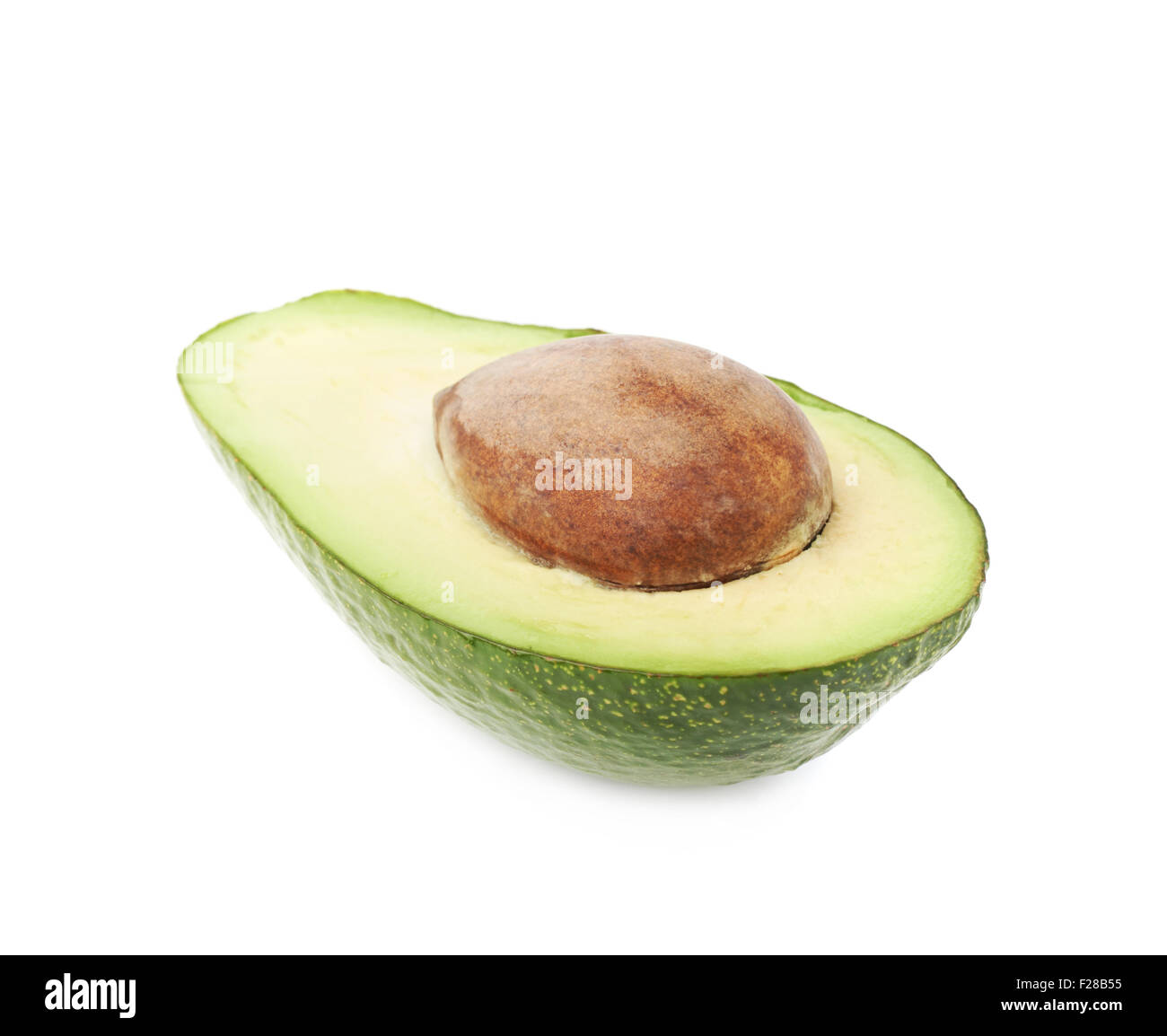 Cut in half open ripe avocado fruit with the pit, isolated over the ...