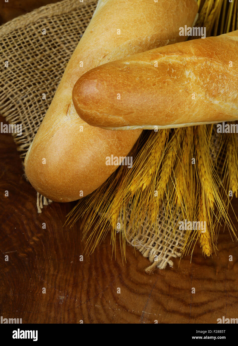 fresh French baguette (bread) on wooden background Stock Photo - Alamy