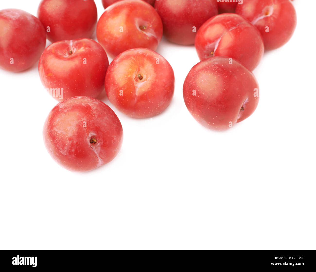 Pile of multiple red victoria plums isolated over the white background ...