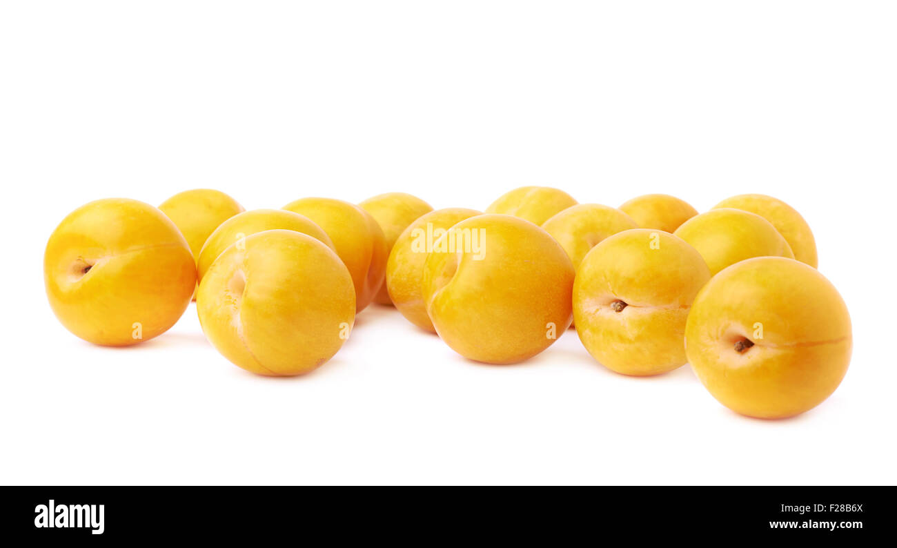 Pile of multiple yellow mirabelle plums isolated over the white ...