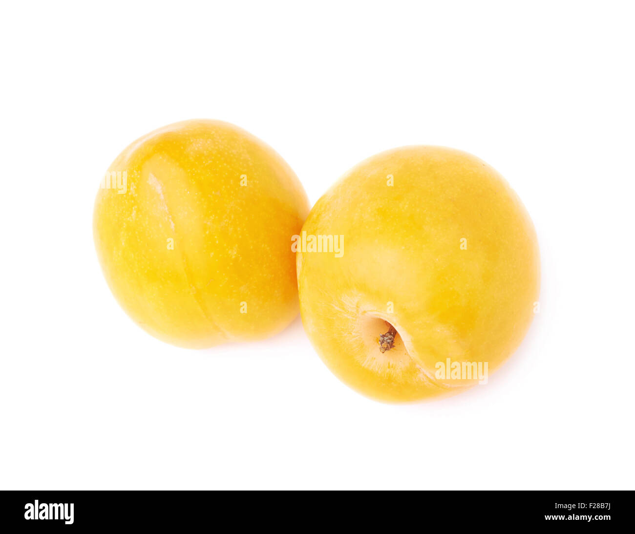 Multiple yellow mirabelle plum fruits composition isolated over the ...