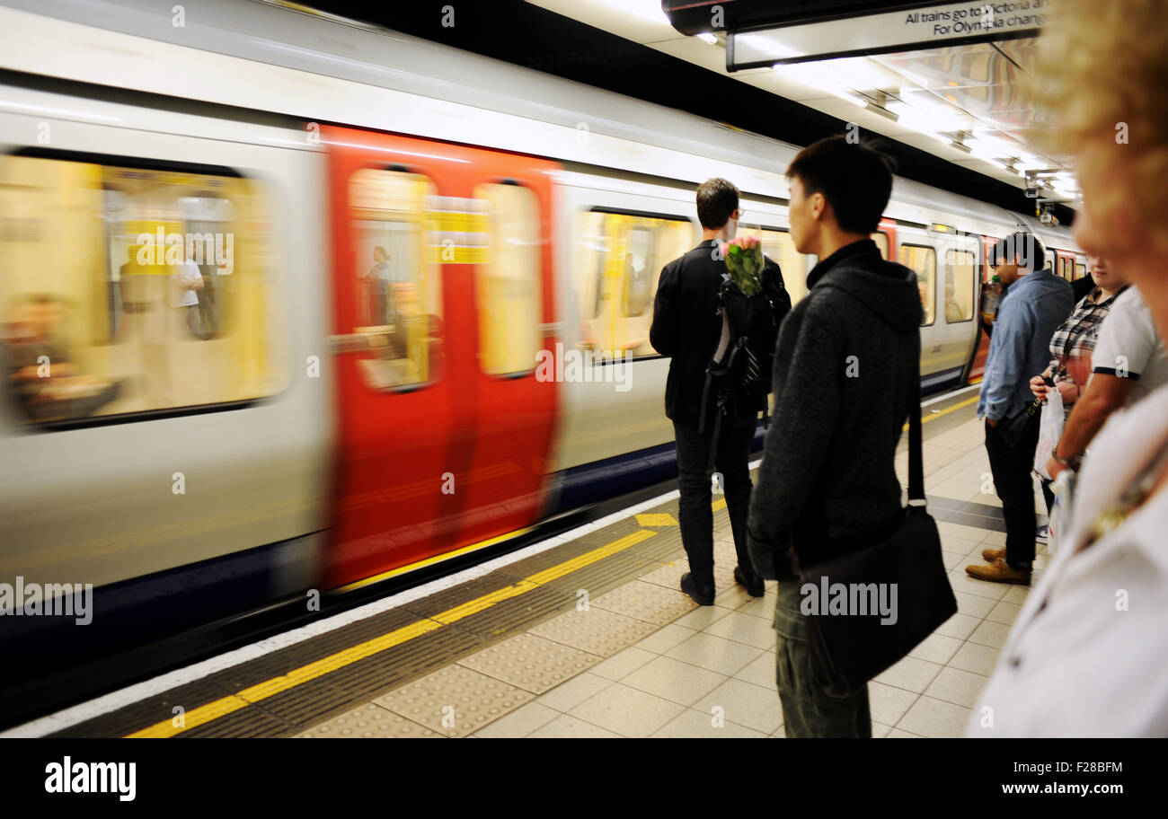 London UK - Catching an underground tube train at Embankment station on ...