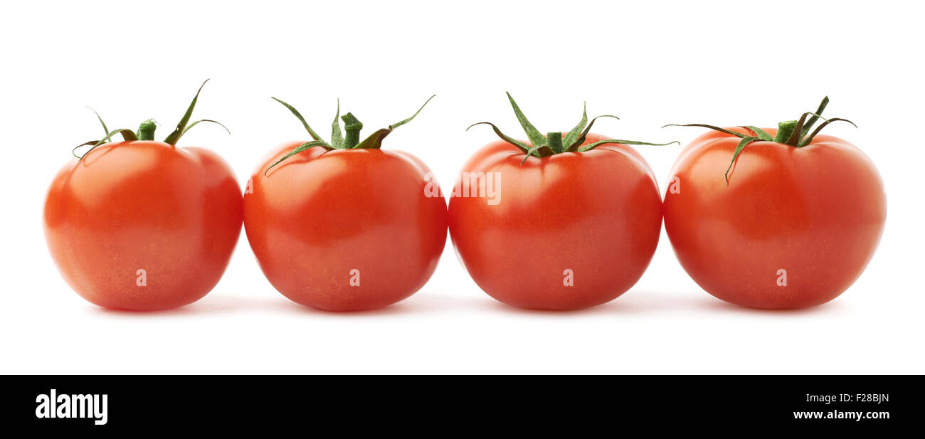 Four tomatoes in a line isolated Stock Photo - Alamy