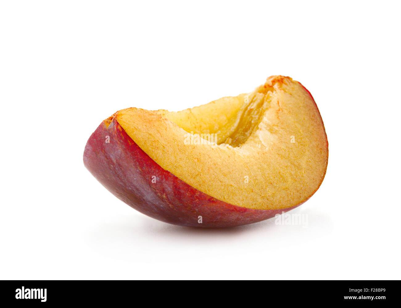Plum fruit slice closeup isolated on white Stock Photo - Alamy