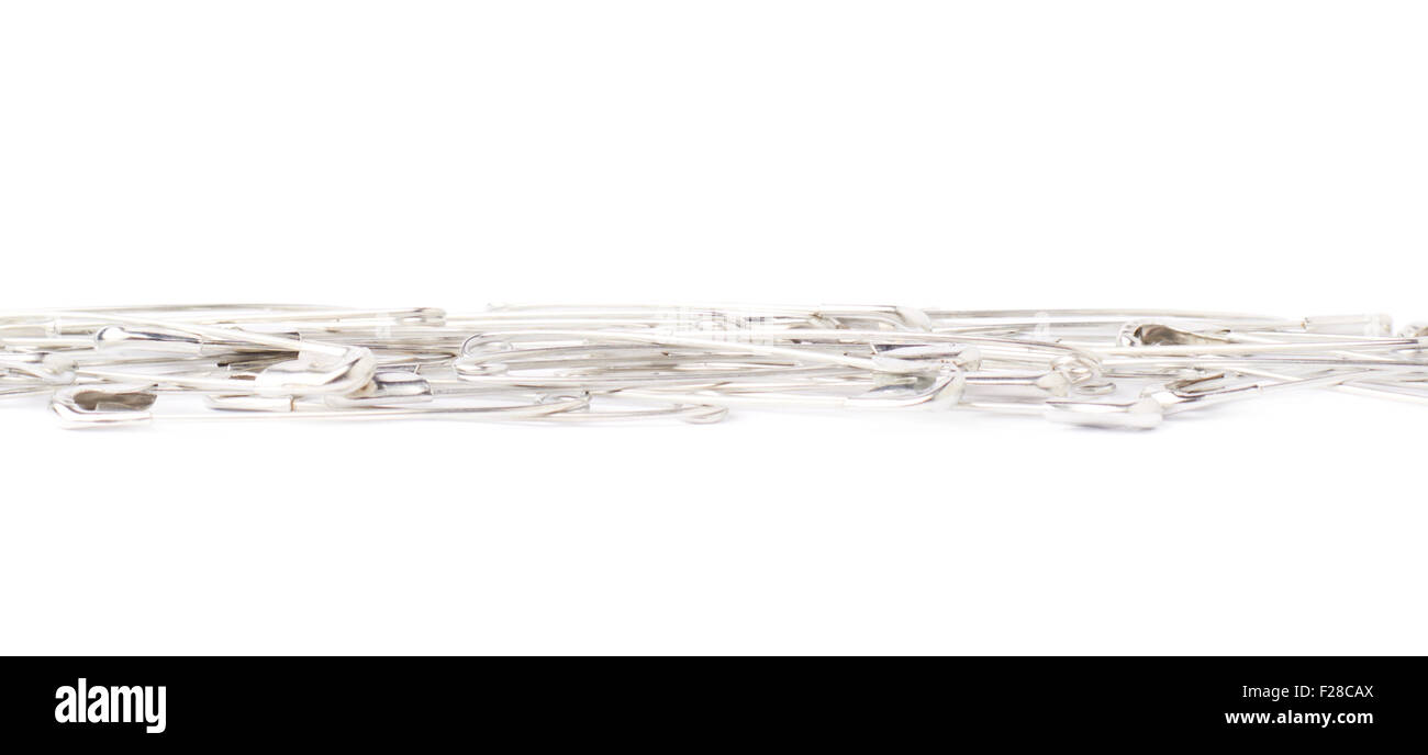 Line border made of multiple safety pins isolated on white background ...