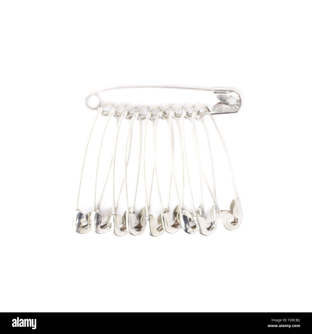 Bunch of safety pins isolated on white background Stock Photo - Alamy