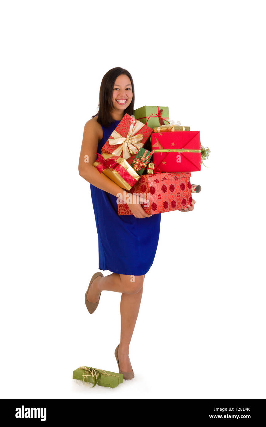 Attractive young woman holding too many Christmas presents Stock Photo ...