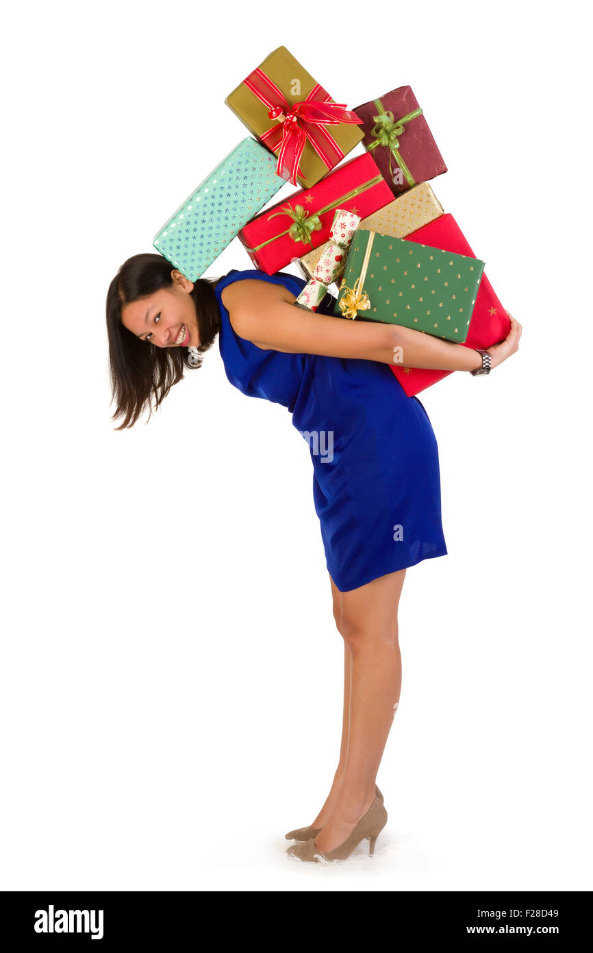 Attractive young woman holding too many Christmas presents Stock Photo ...